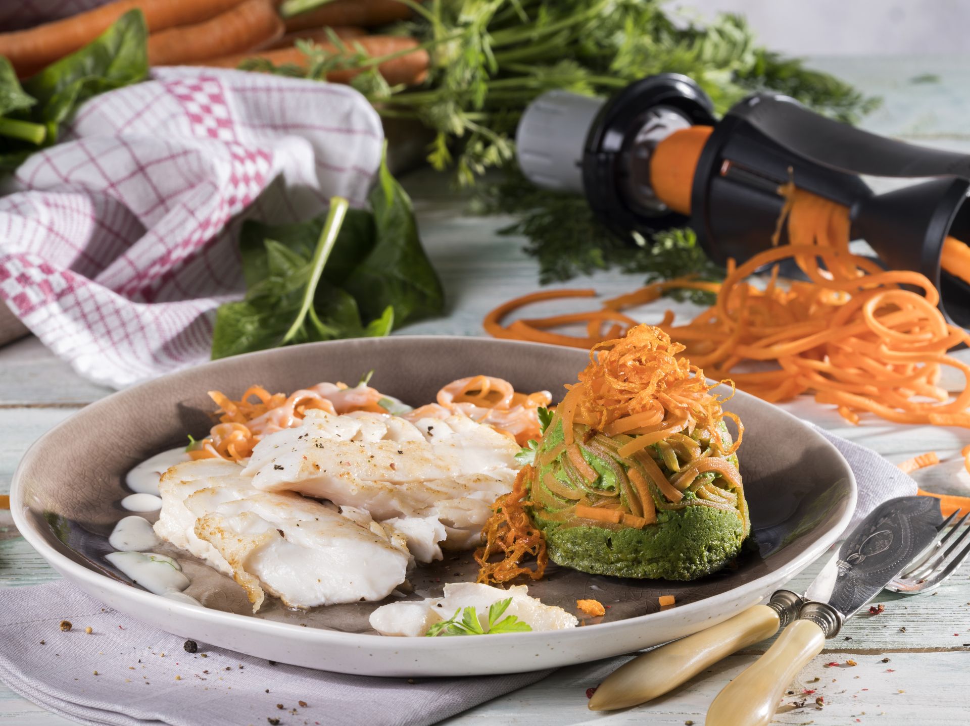 Carrot spinach flan with fried cod and carrot stra